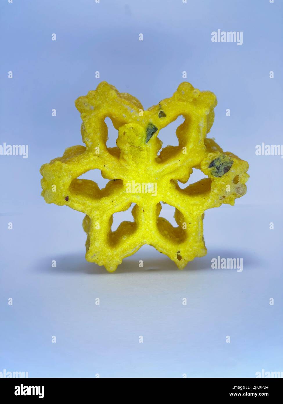 A traditional yellow Kokis sweet on a white background Stock Photo - Alamy