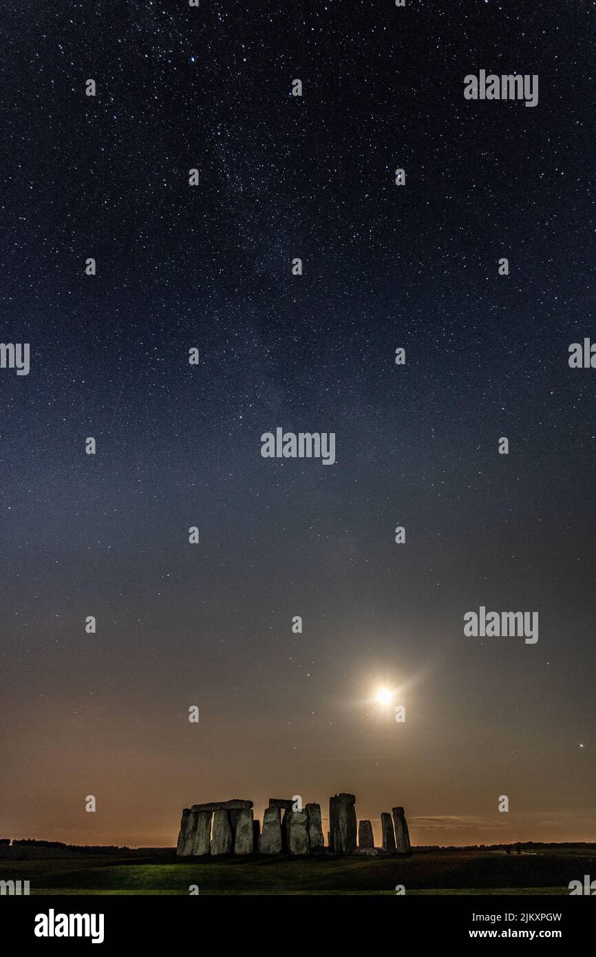 A vertical shot of the Stonehenge and the beautiful Milky Way in the ...