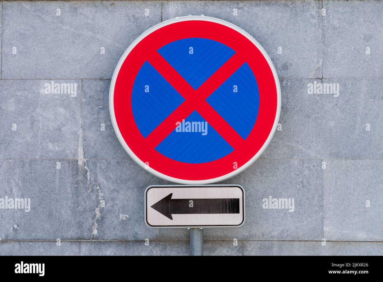 A red and blue traffic sign - prohibited parking and left Stock Photo ...