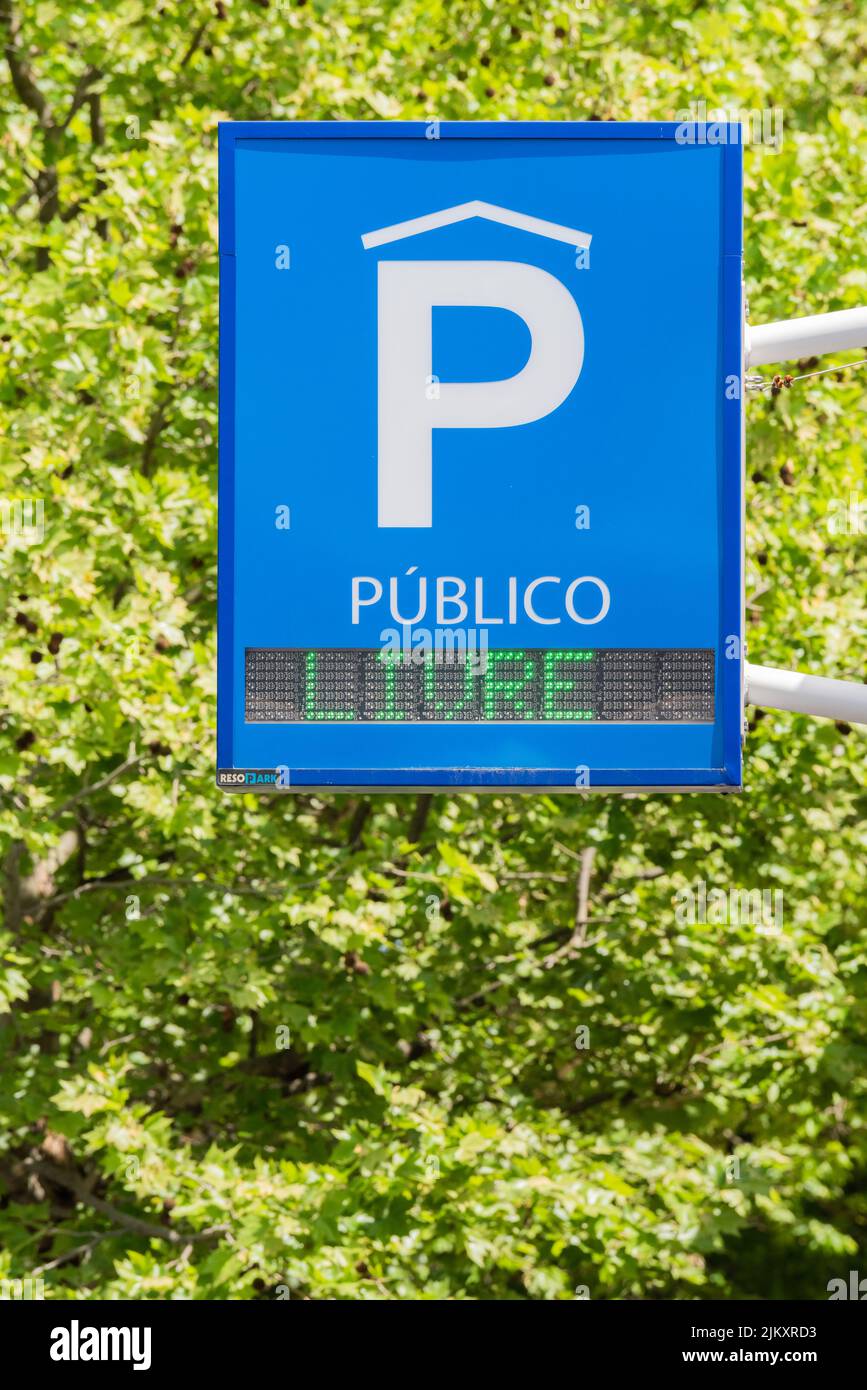 An illuminated parking sign outside parking garage structure Stock ...