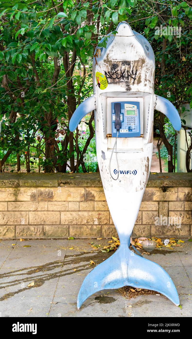 Old street pay phone booth in the form of a dolphin, Kadikoy, Istanbul ...
