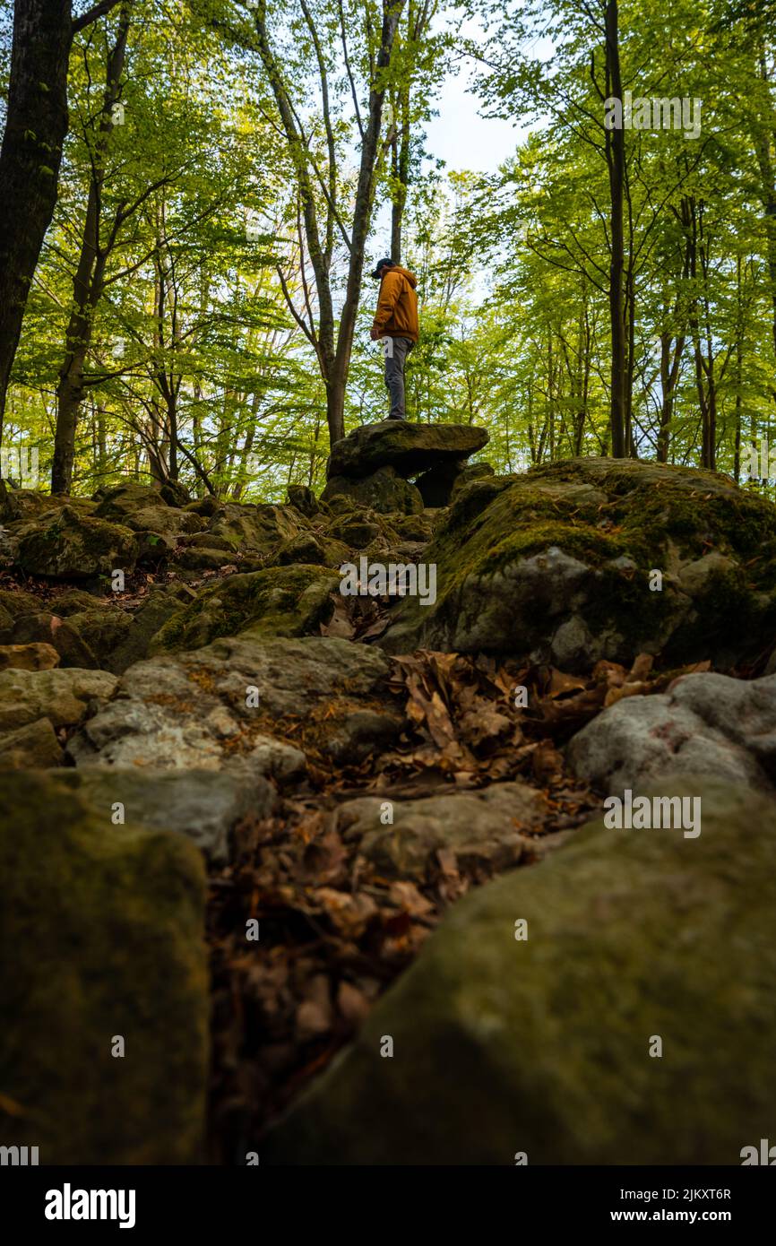 A man at the Aitzetako Txabala Dolmen in the Basque Country. Errenteria ...