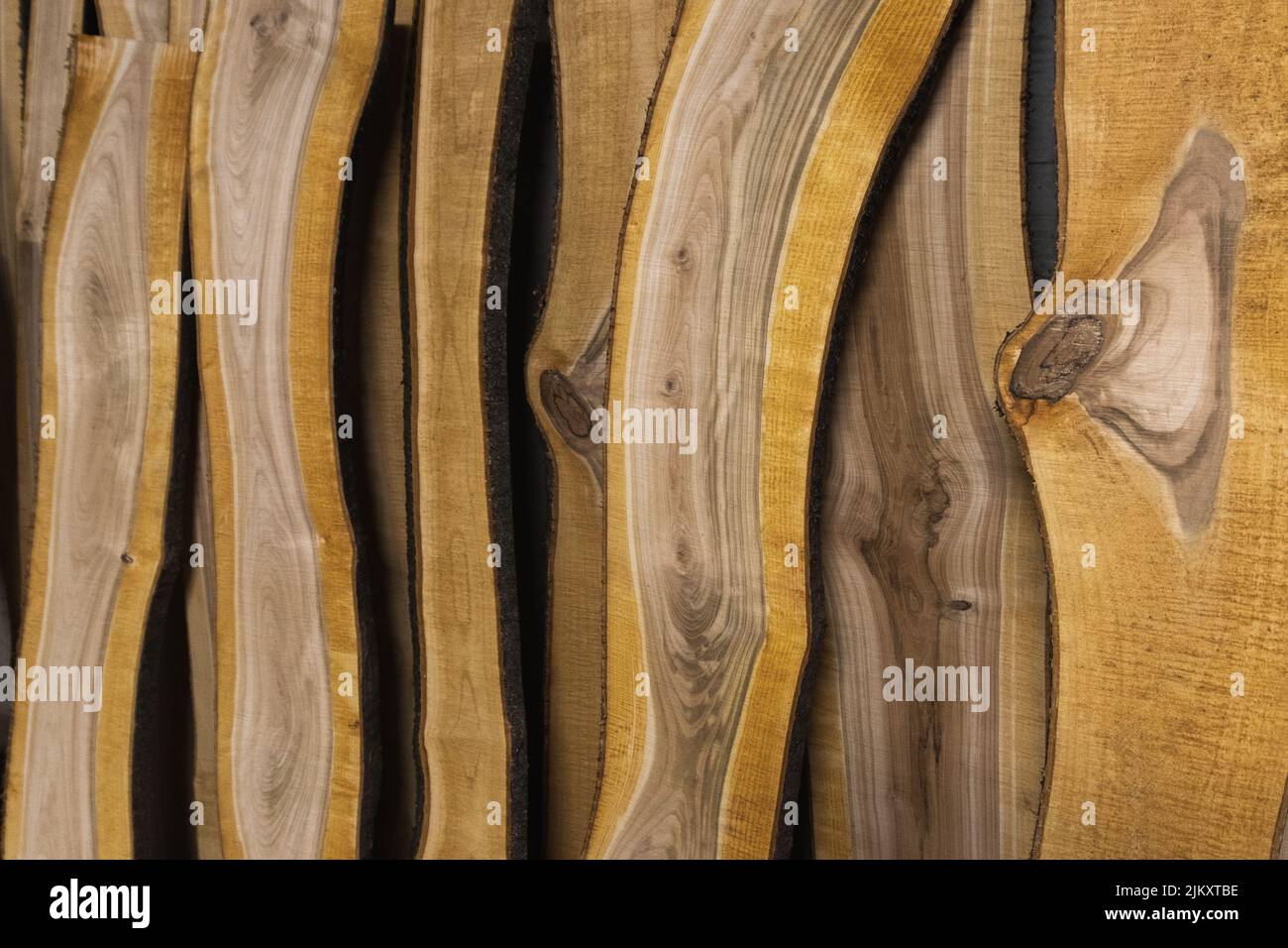 A closeup of cut wooden planks leaning vertically Stock Photo - Alamy