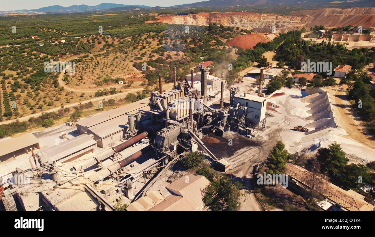 Environment pollution concept. Factory with chimneys in an open pit ...