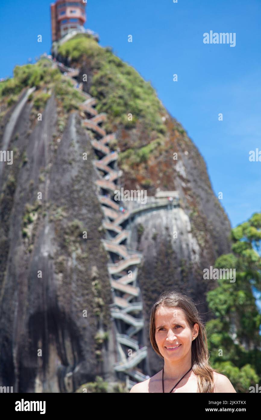 Female tourist at the famous Piedra del Peñol a monolithic stone ...