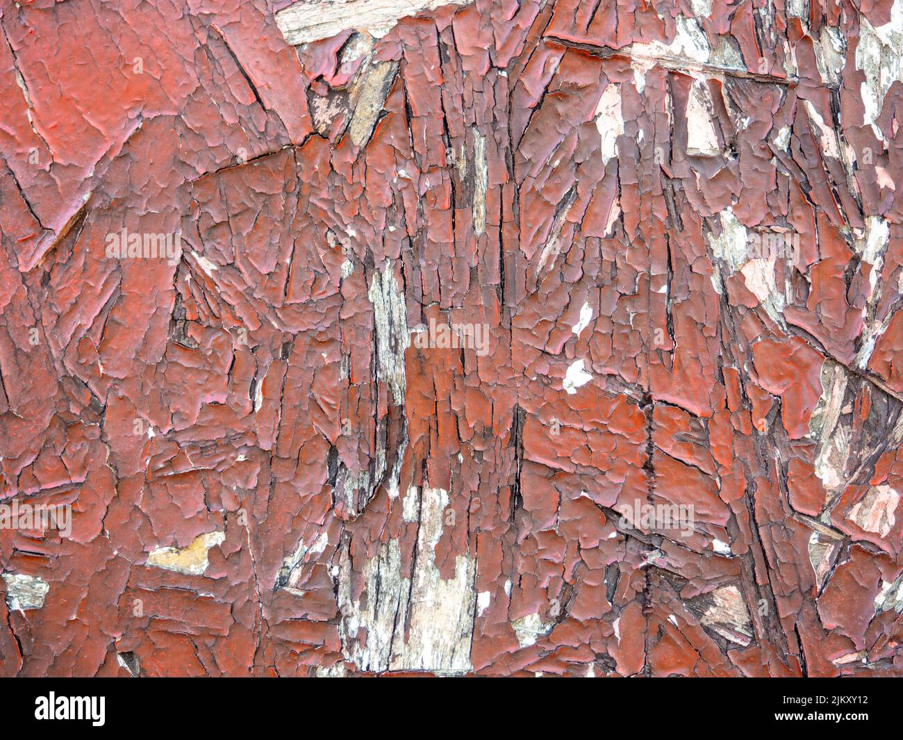 Chipboard in red paint. Background from a painted board. Pattern ...