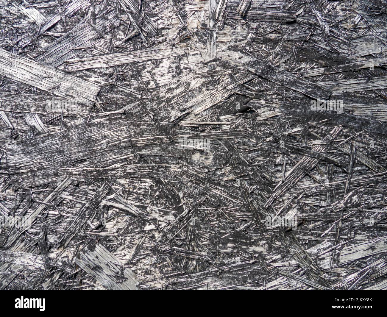 Chipboard in black paint. Background from a painted board. Pattern of ...