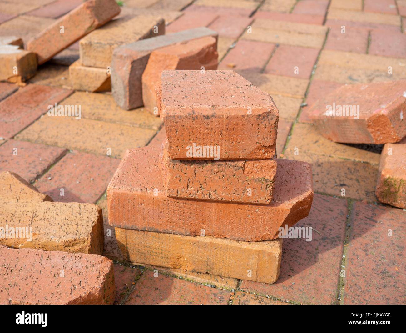 Old red broken bricks. Abandoned building materials. Camry on tile ...