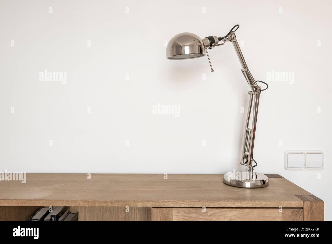 classic desk lamp with empty white wall background Stock Photo - Alamy