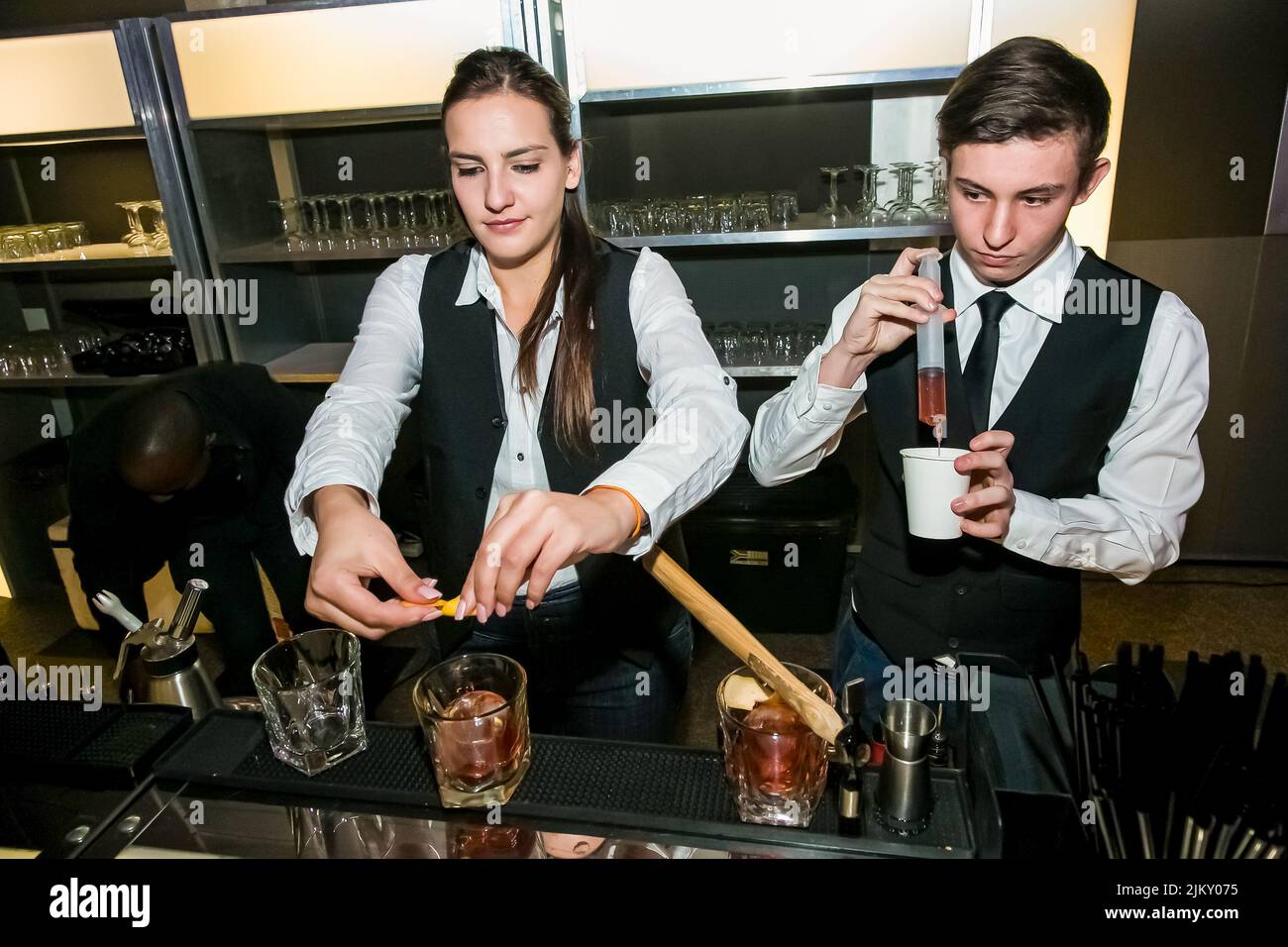 Two barmen making cocktail drink at party event in Johannesburg, South ...