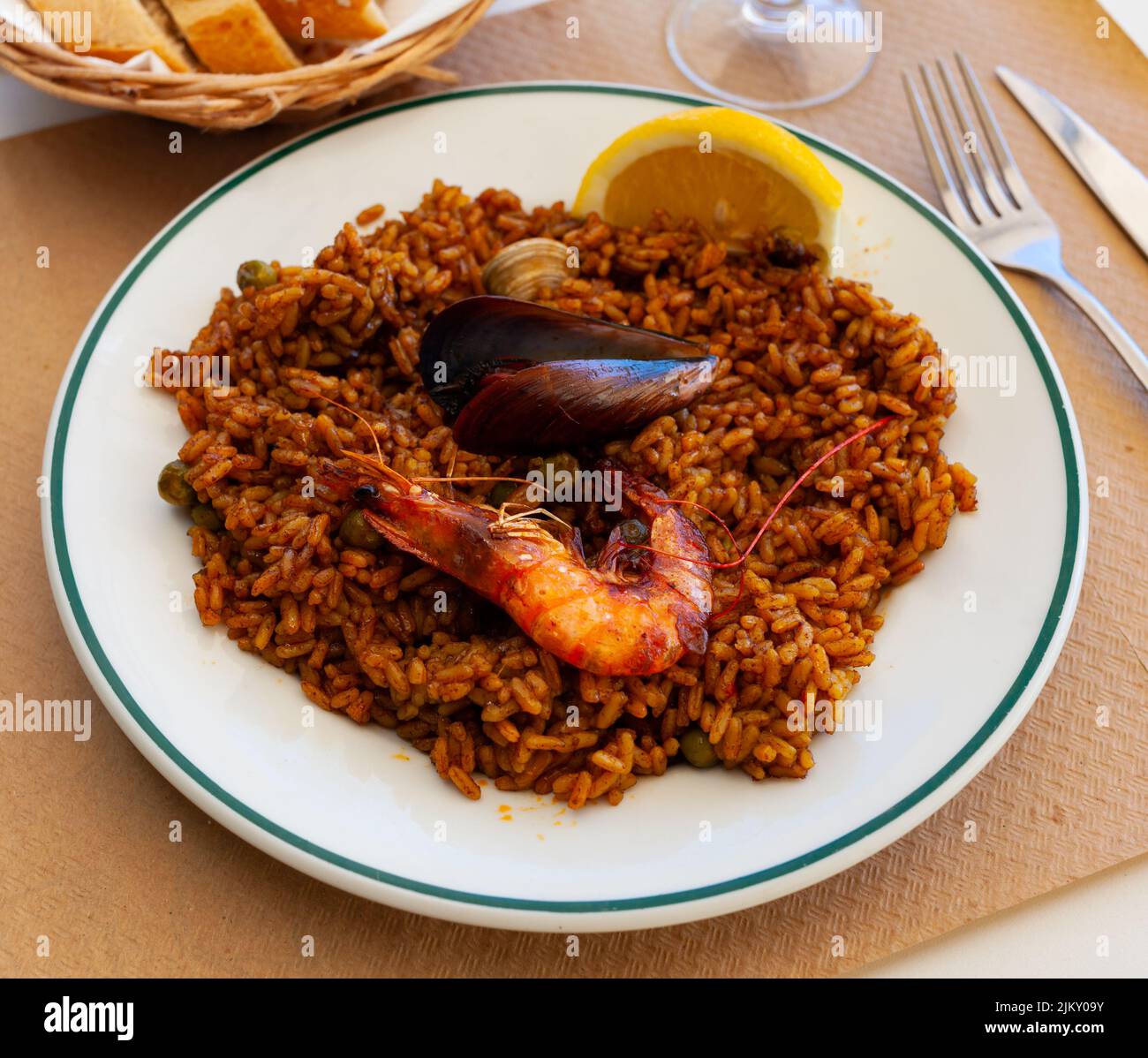 Valencian paella de mariscos with shrimps, calamaries, mussels Stock ...