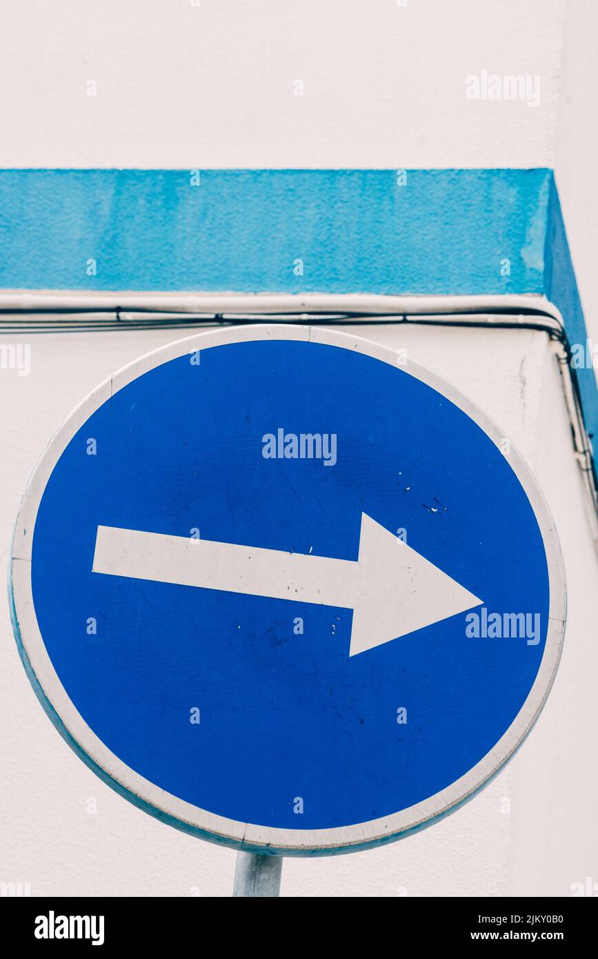 Blue traffic sign white arrow hi-res stock photography and images - Alamy
