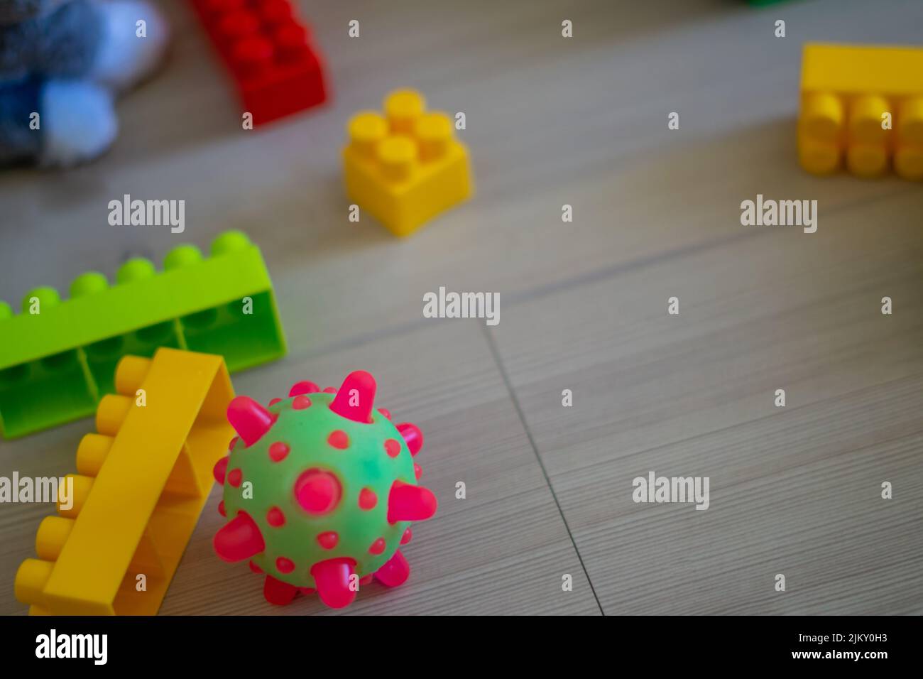 little girl playing with toys at home, legos type toys Stock Photo - Alamy