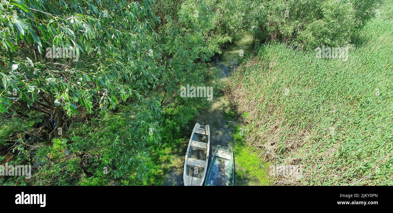 The top shot of riverboats on a tiny river Stock Photo - Alamy