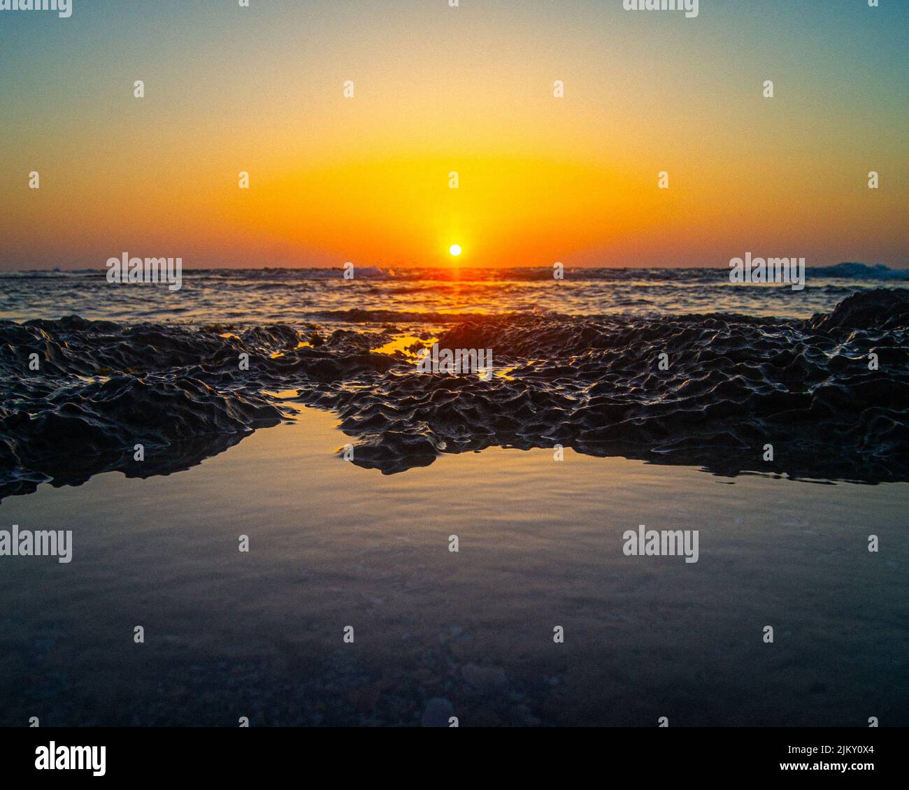 A scenic view from the beach with rocks and transparent water to the ...