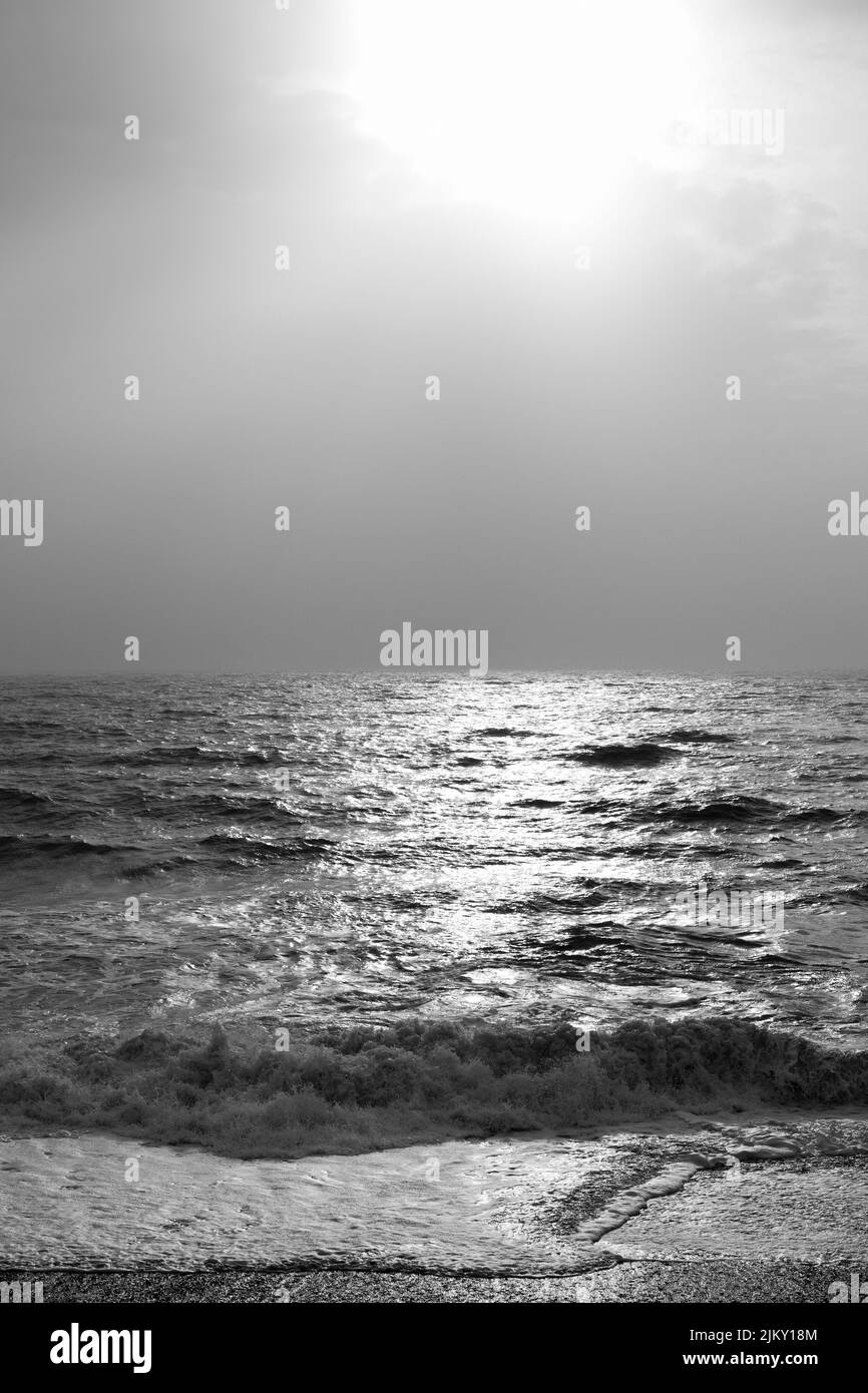 Sea waves sunset light Black and White Stock Photos & Images - Alamy