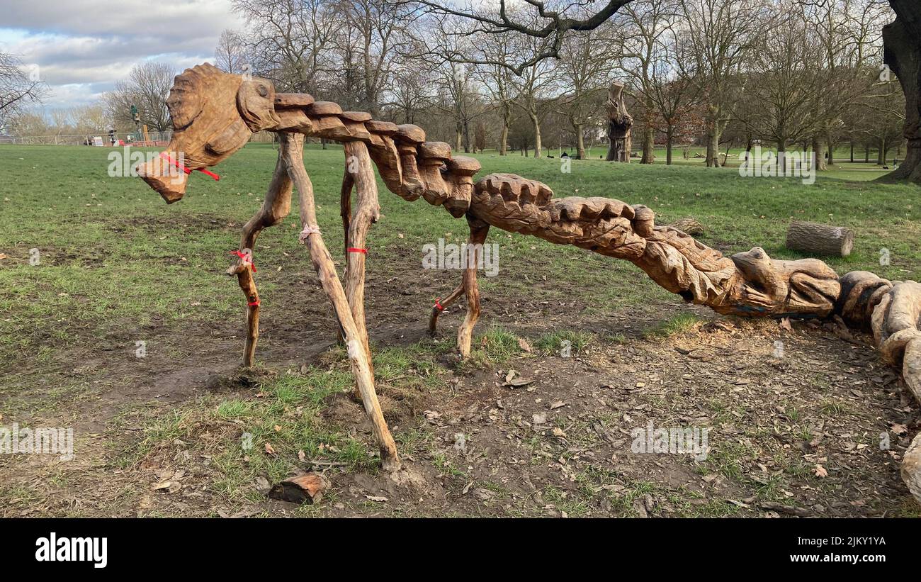 An artwork made from pieces of tree in the London park, Brixton, United ...