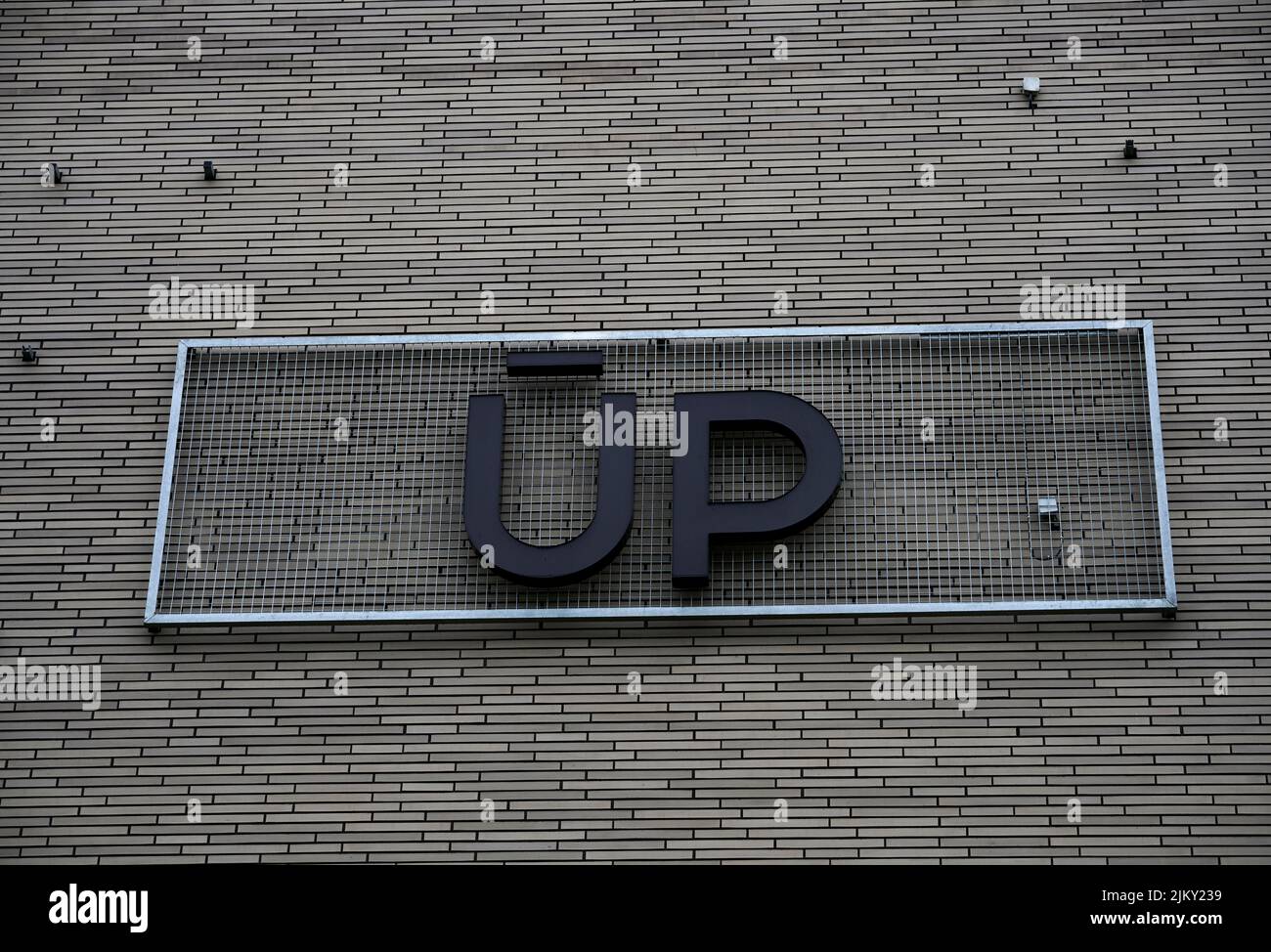 UP fitness club logo on a brick wall of the Business Garden office ...