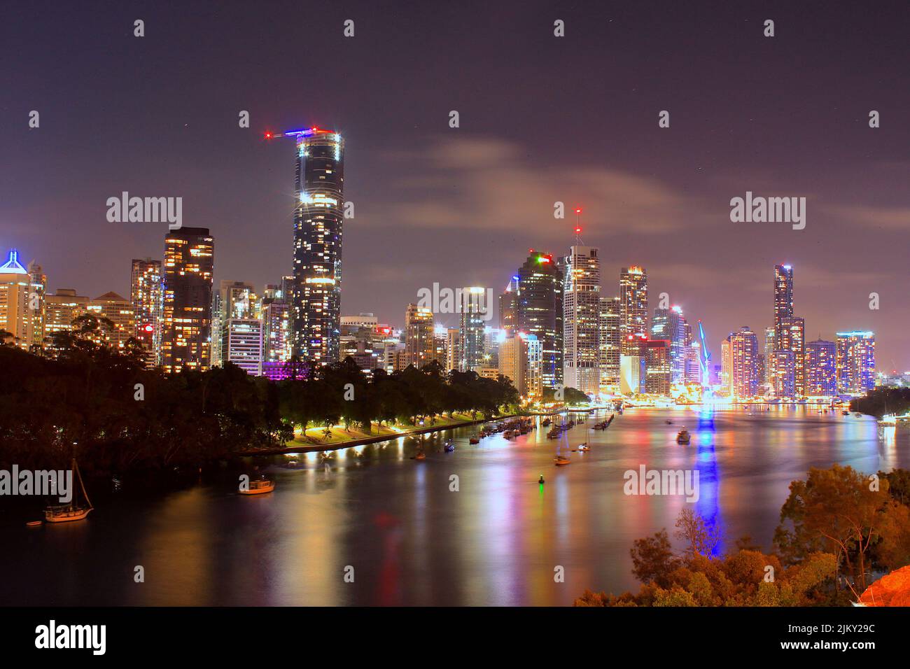 The skyline of Brisbane at night reflected on water Stock Photo - Alamy