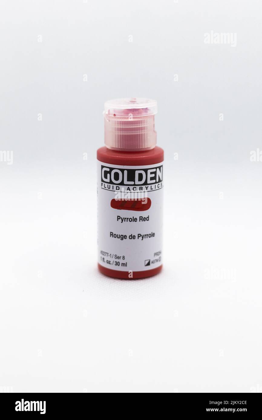 A bottle of Golden red paint on a white background Stock Photo - Alamy