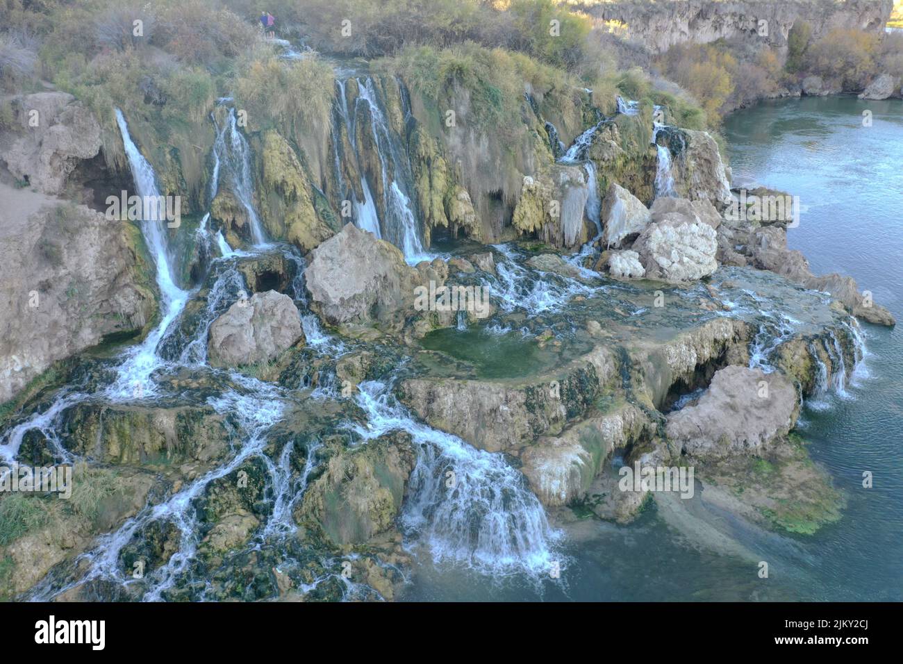 An aerial distant view of a landscape with cliffs and waterfalls Stock ...
