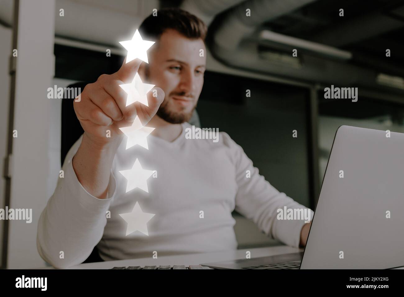 Man giving a 5 star rating for a on-line service or product Stock Photo ...
