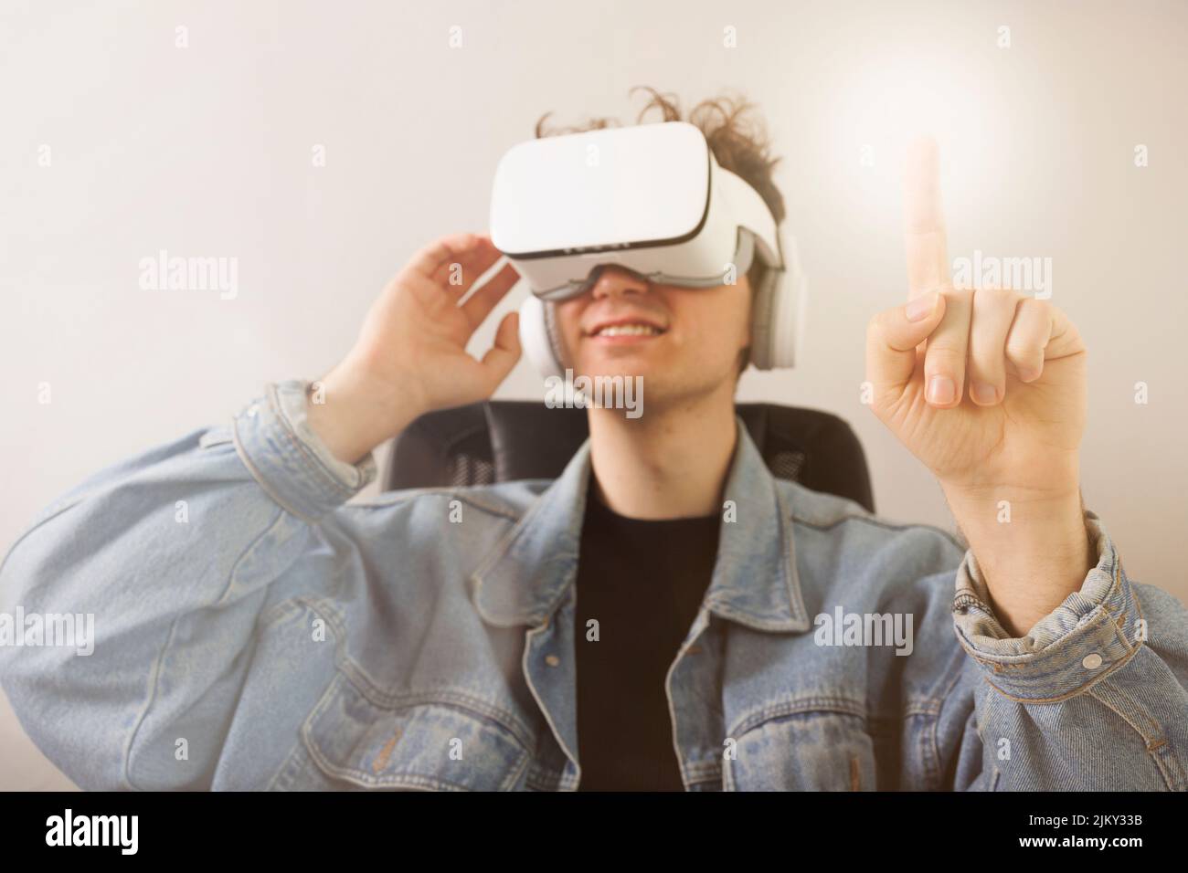 Excited young man watching something hi-res stock photography and ...