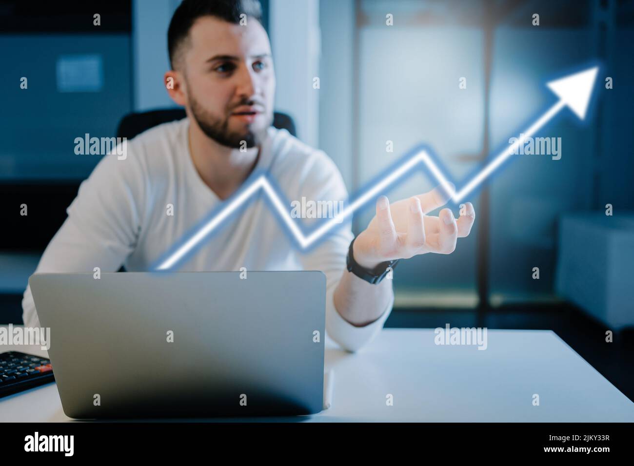 Business person with a growing graphic Stock Photo - Alamy