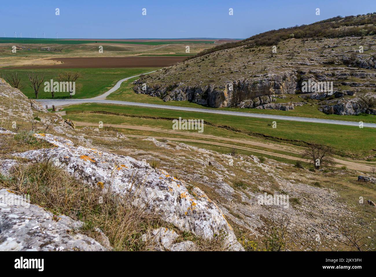 A rural road surrounded by fields in Dobruja, Romania Stock Photo - Alamy