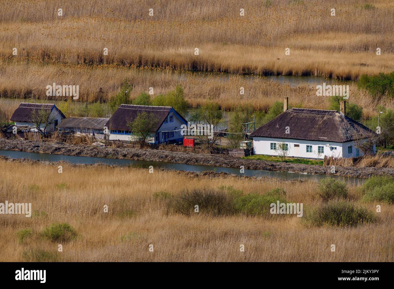The rural houses by the river in Dobruja, Romania Stock Photo - Alamy