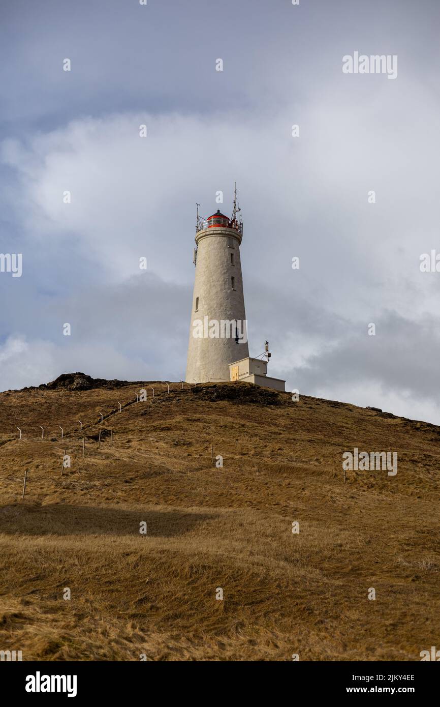 A vertical shot of the famous Reykjanes lighthouse in Iceland under a ...