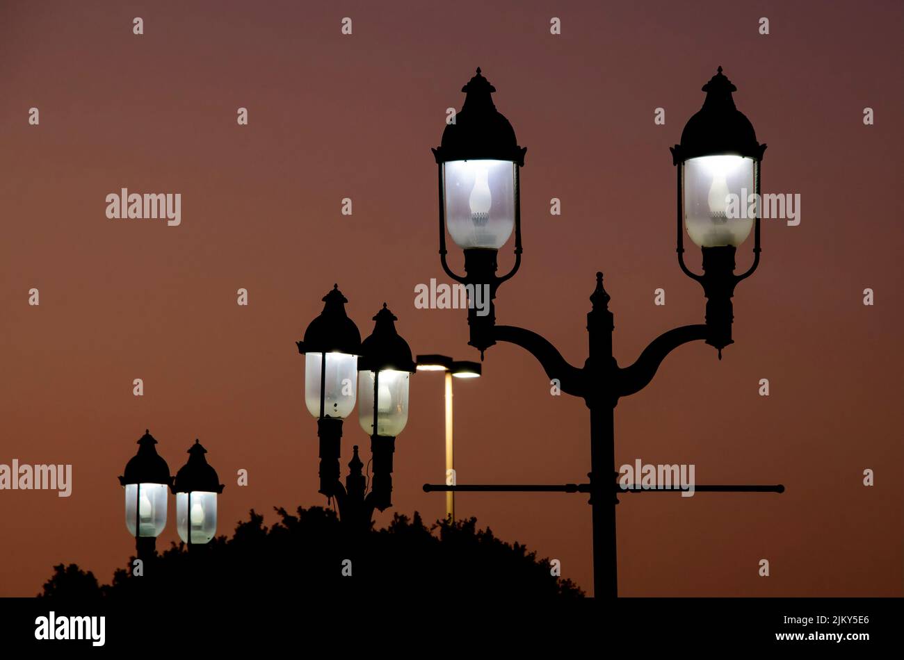 Patterns made by pairs of street lamps during sunset in Abu Dhabi Stock ...