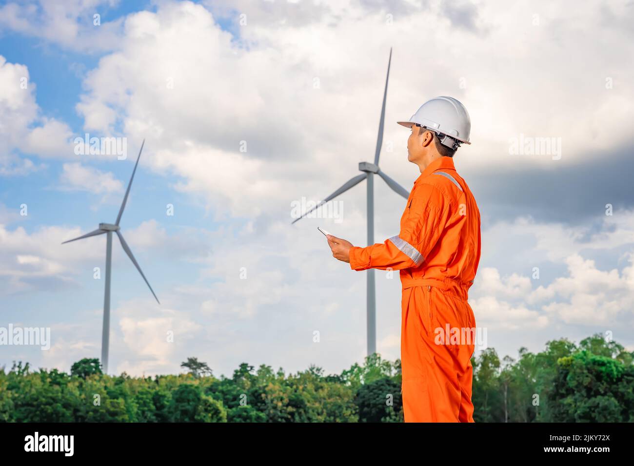 Engineer walk to check wind power plants with check performance. Wind ...