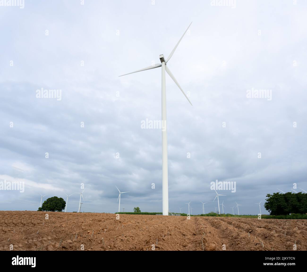Wind turbines of global ecology with cloud background on the sky ...