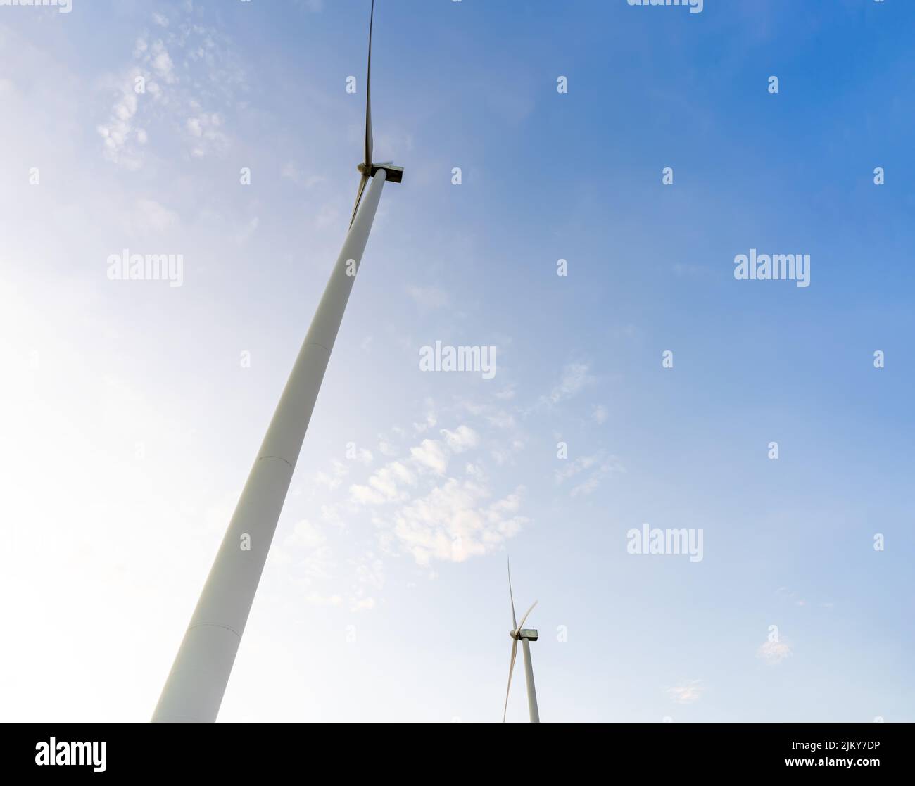 Wind turbines of global ecology with cloud background on the sky ...