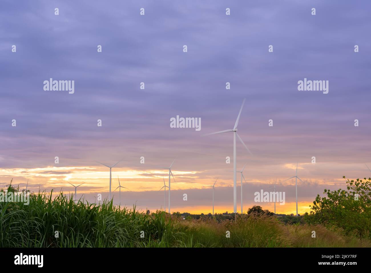 Wind turbines of global ecology with cloud background on the sky ...