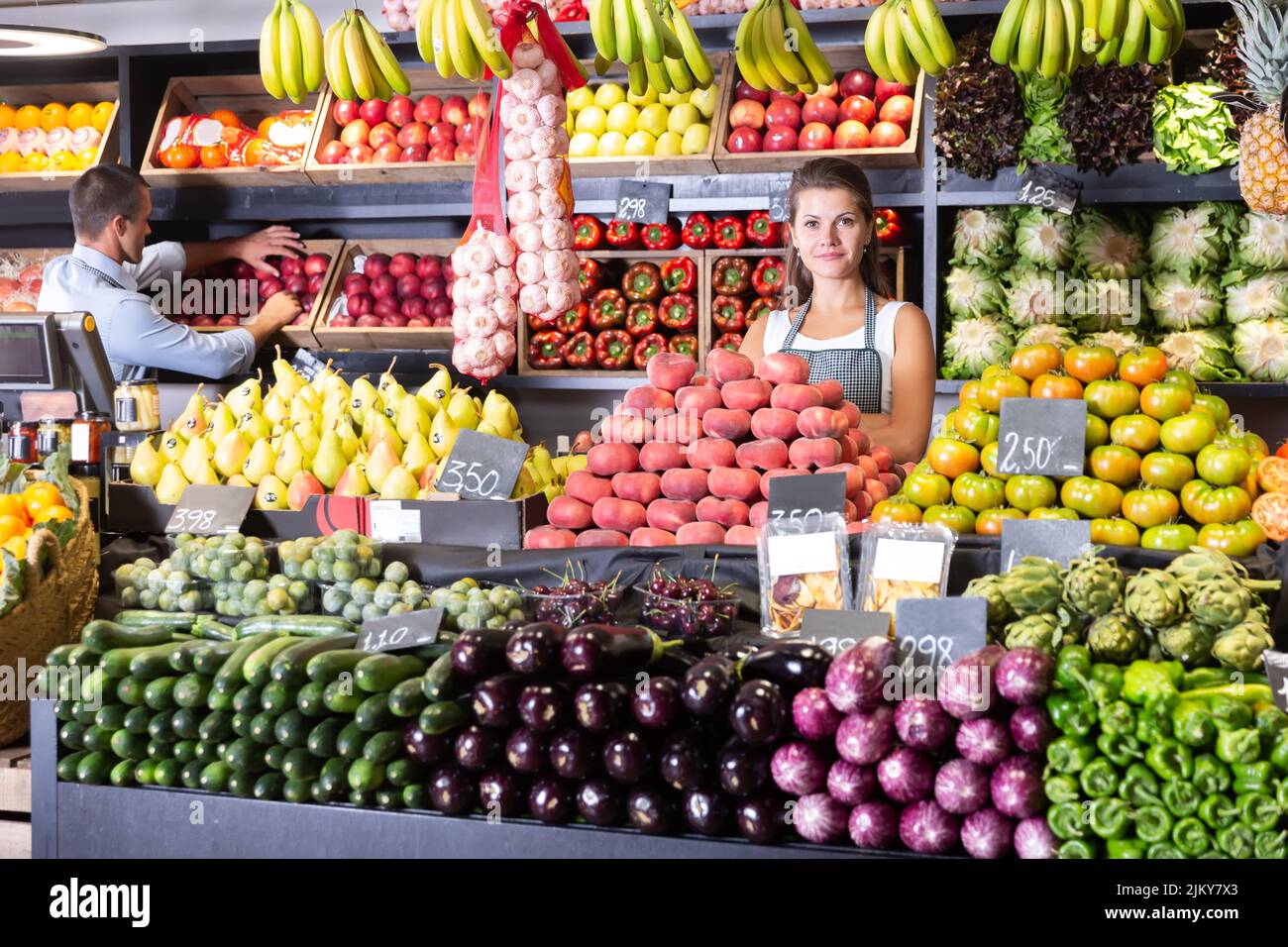 female vendor offers fruits and vegetables Stock Photo - Alamy