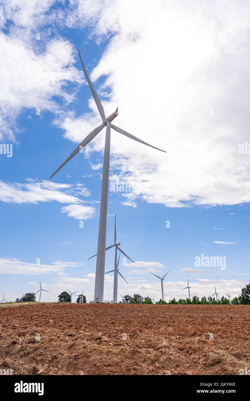 Wind turbines of global ecology with cloud background on the sky ...