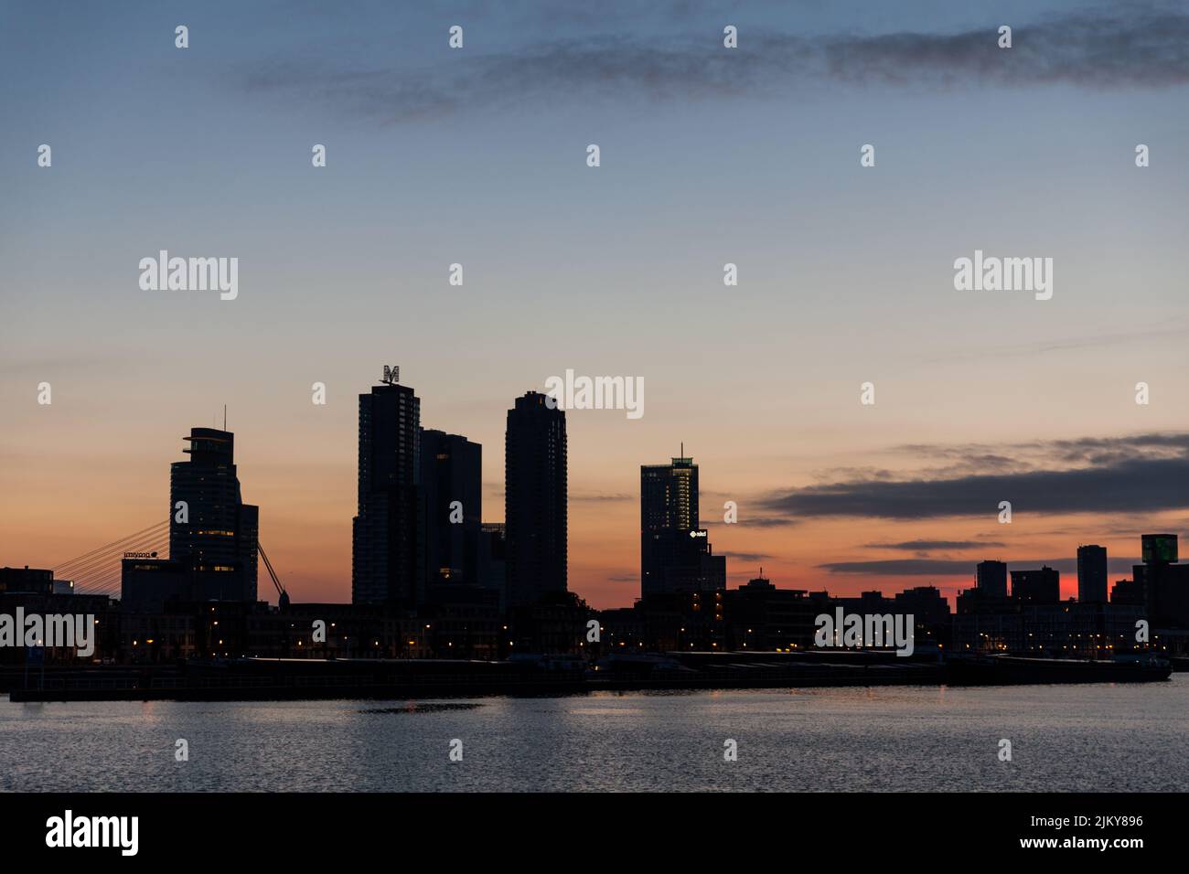 An aerial view of modern buildings near the water at sunset Stock Photo ...
