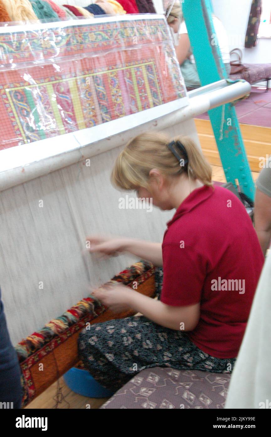 Woman working at her loom Stock Photo - Alamy
