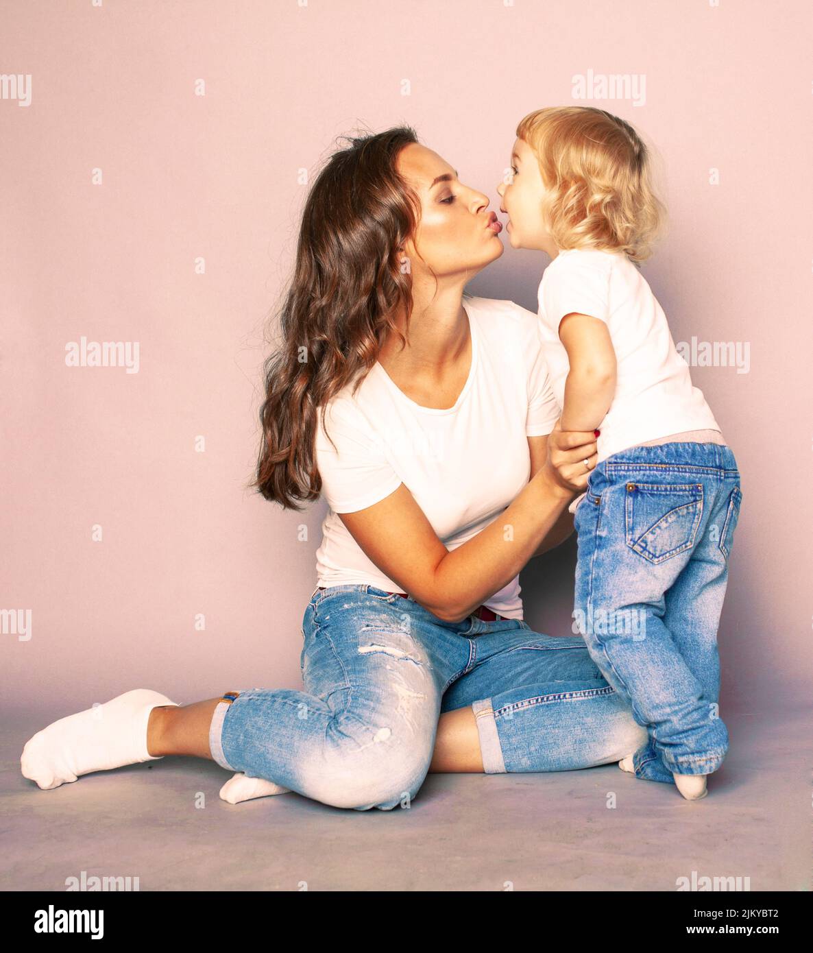 bright picture of hugging mother and daughter happy together, smiling ...