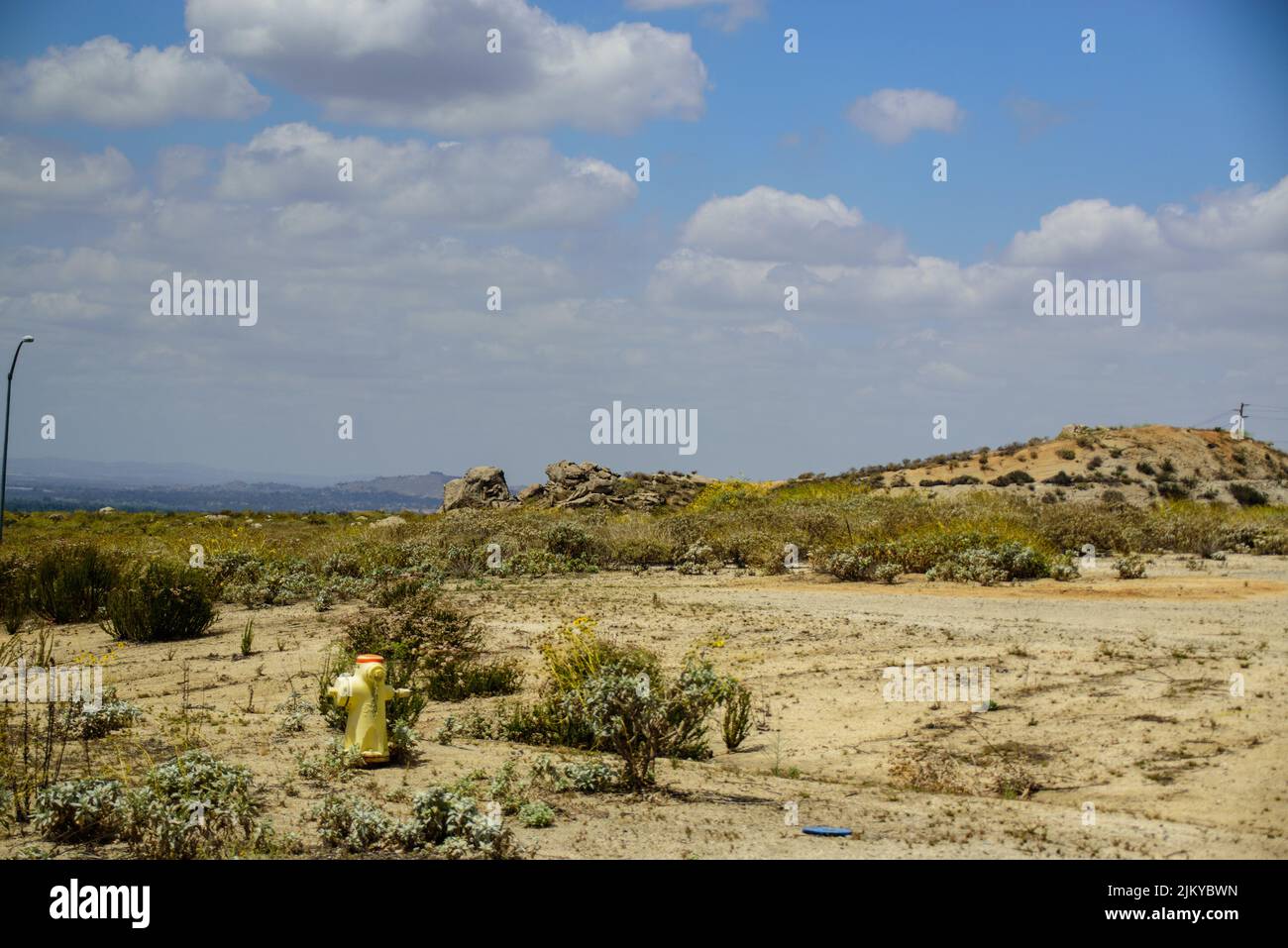 An empty dry field and hills Stock Photo - Alamy