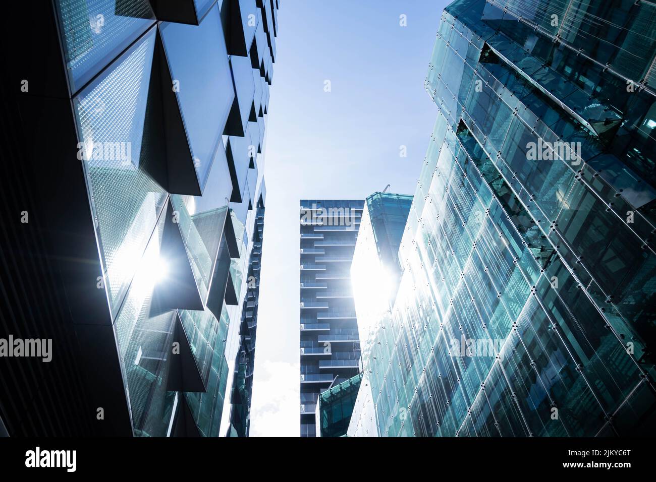 A low angle shot of the exterior designs of modern company's buildings ...