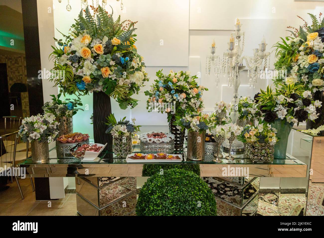 A wedding catering table with floral decorations Stock Photo - Alamy