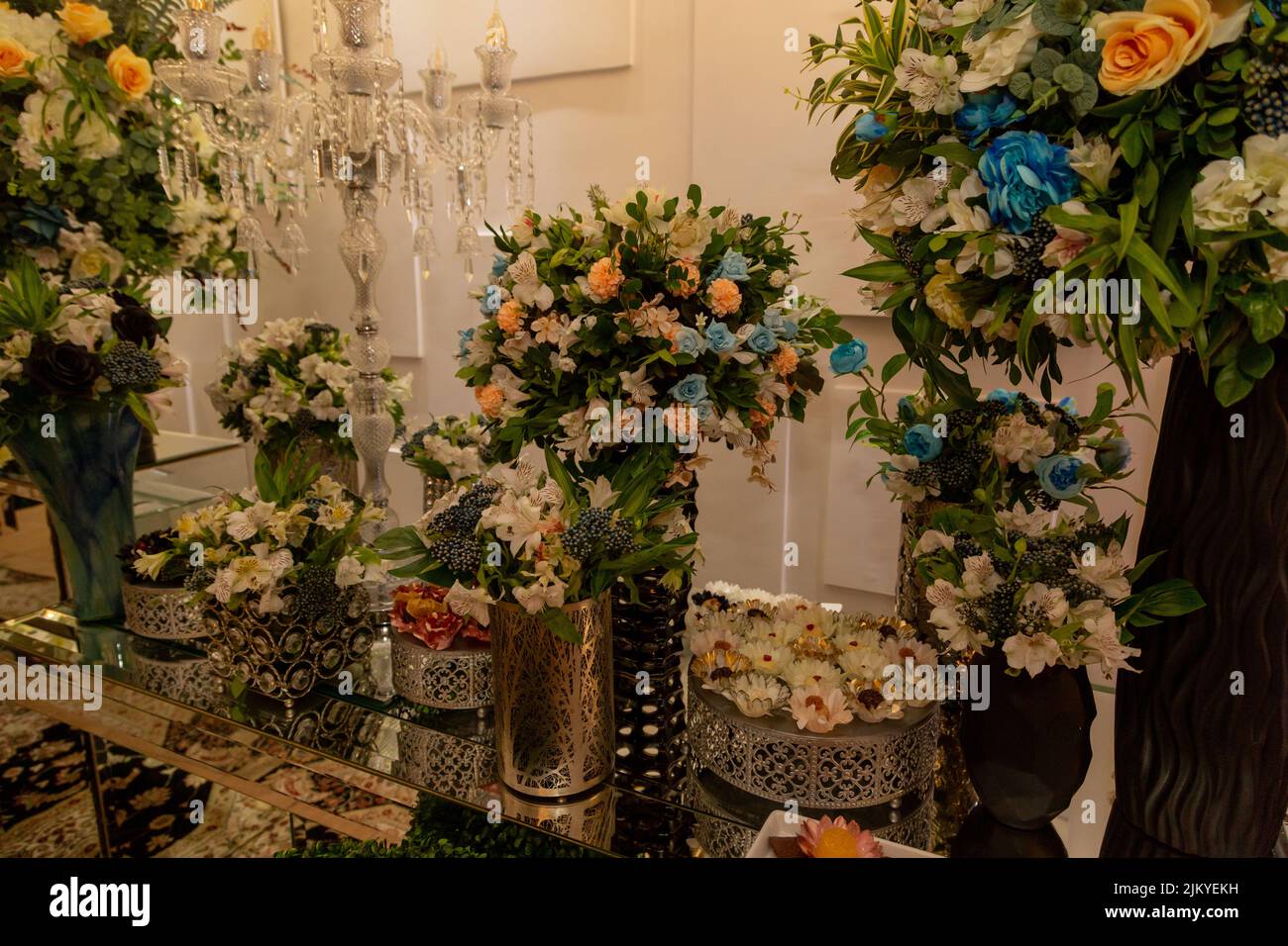 A wedding catering table with floral decorations Stock Photo - Alamy