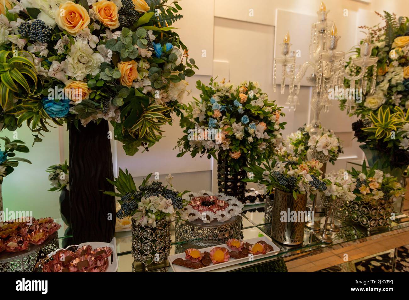 A wedding catering table with floral decorations Stock Photo - Alamy