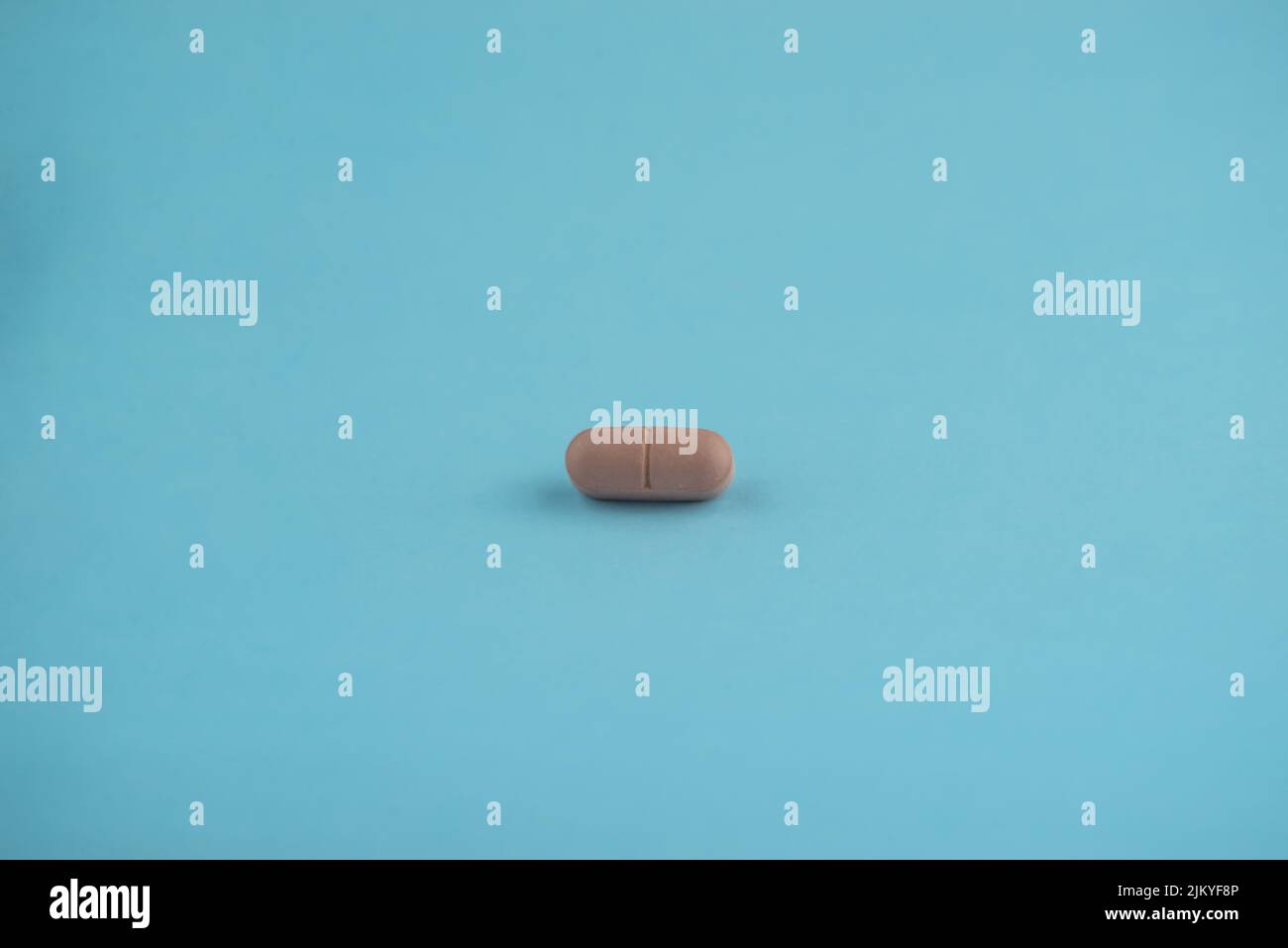 Brown capsule pill close hi-res stock photography and images - Alamy