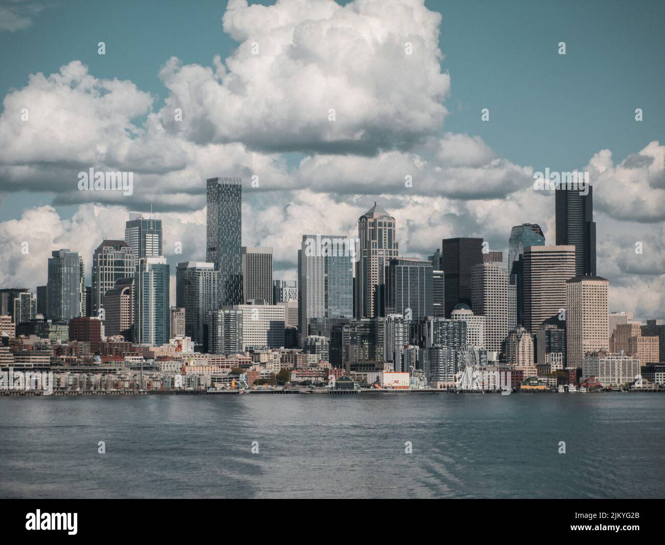 A beautiful shot of waterfront cityscape against a cloudy sky in ...