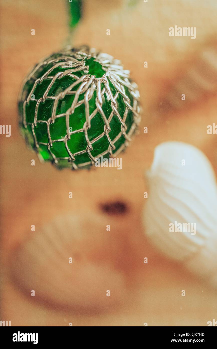 Sea shells on the wall with glass wire bead Stock Photo - Alamy
