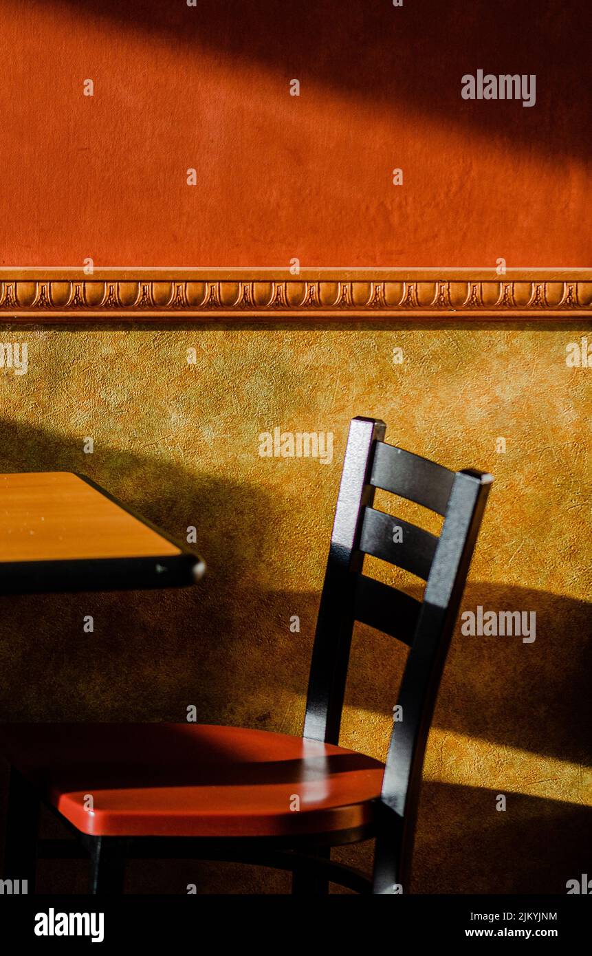A vertical shot of a chair in an empty cafe Stock Photo - Alamy